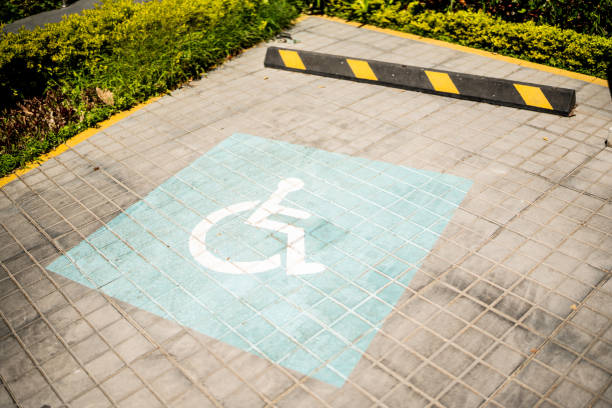 Free picture: Parking lot with a yellow wheelchair symbol, a handicap ...