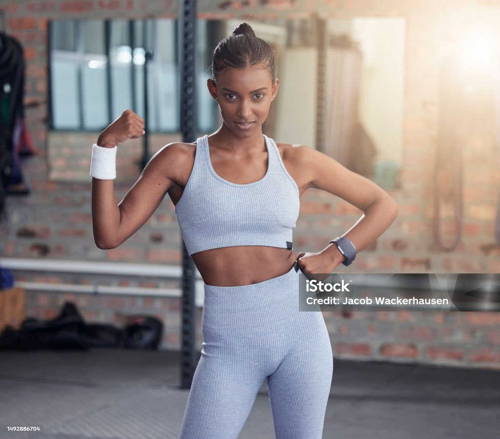 Woman Fitness And Portrait Flexing Bicep For Empowerment Exercise Or
