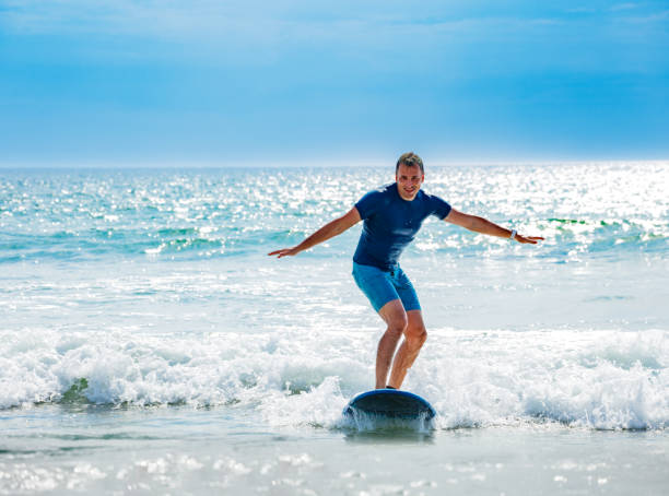 Free Stock Photo of Person Riding Surfboard on Body of Water | Download ...
