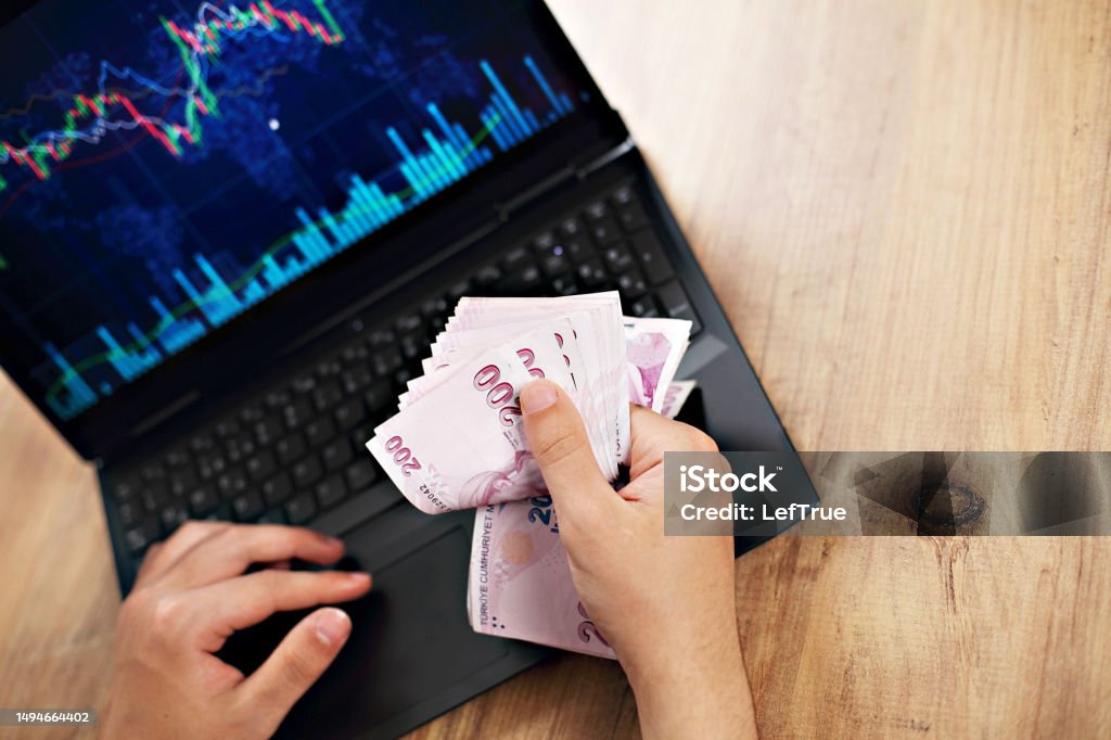Unrecognizable Man Investigating Blue Bar Graph While Counting Turkish ... Unrecognizable Man Investigating Blue Bar Graph While Counting Turkish ...