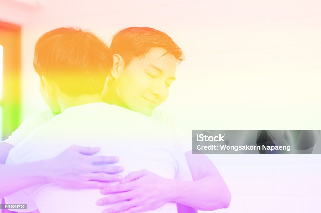 Happy Asian Gay Couple Hug Together On Sofa Asian Lgbt Couple Embracing