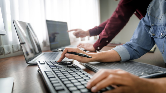 Programming Developing Software Application Programmer Writing Program Code With Two Monitors
