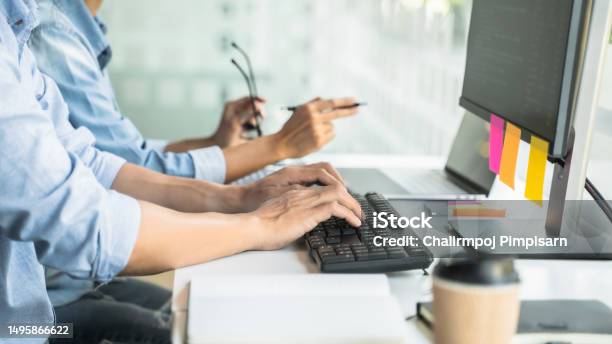 Programming Developing Software Application Programmer Writing Program Code With Two Monitors