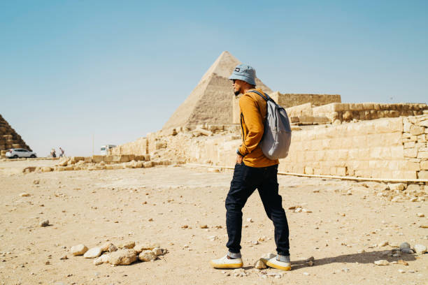 Free Stock Photo of Man Standing in Front of a Very Tall Pyramid ...