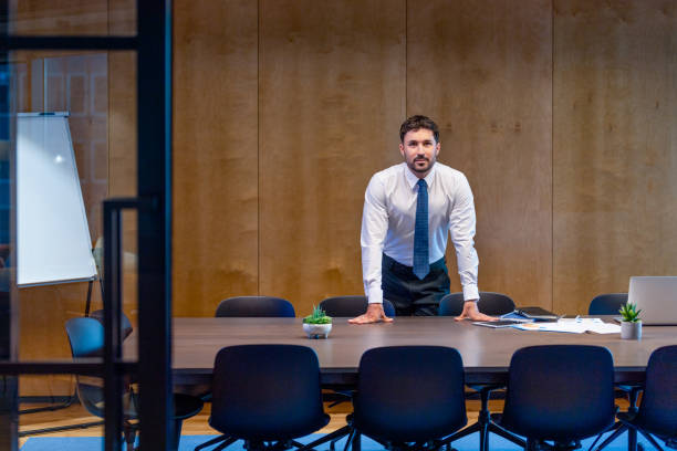 Free Stock Photo of Man Standing at Table in Large Room | Download Free ...