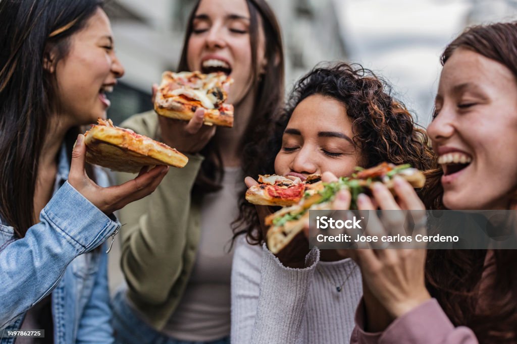 Cheerful Multiracial Women Eating Pizza On The Street Happy Millennial