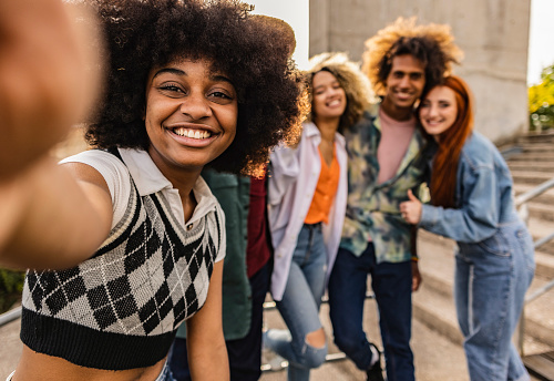 Group Of Young Friends Making Selfie Outdoors Focus On African Woman