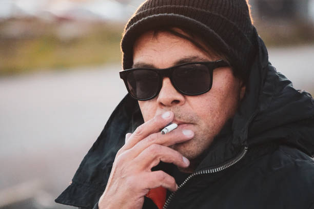 Free Stock Photo of Man Smoking Cigarette on City Street | Download ...