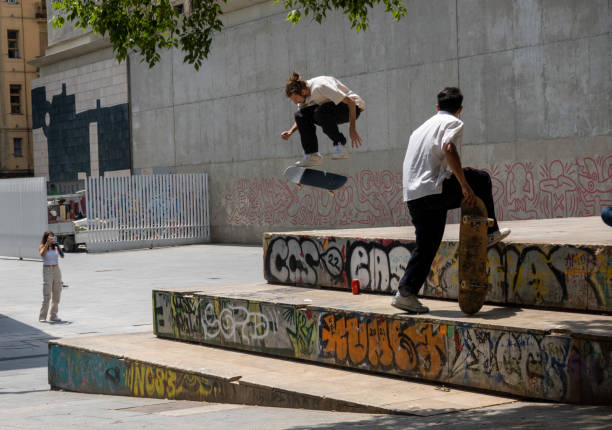 Free Stock Photo of Skateboarder performing trick on graffiti ledge ...