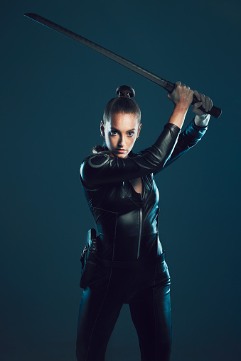 Woman Warrior And Vigilante In Cosplay With Sword Ready For Battle War