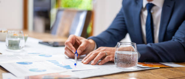 Free Stock Photo of Businessman With Pen Over Financial Data - Finance ...