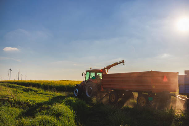 Free Stock Photo of Tractor Pulling Hay Trailer Across Field | Download ...