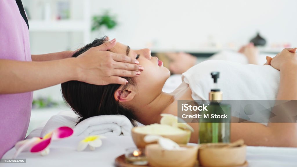 Beautiful Woman Receiving Head Massage In Spa Salon Woman Lying On