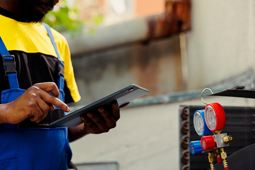 Electrician Doing Hvac System Leak Check Stock Photo - Download Image ... Electrician Doing Hvac System Leak Check Stock Photo - Download Image ...