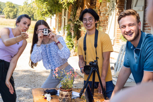 Free Stock Photo of Group of People Standing Around a Camera | Download ...