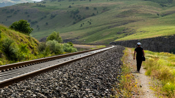 Free Stock Photo of Man walking on railroad tracks in woods | Download ...