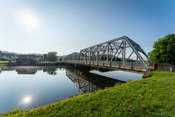 Free Stock Photo of A large metal bridge spanning an urban waterway ...