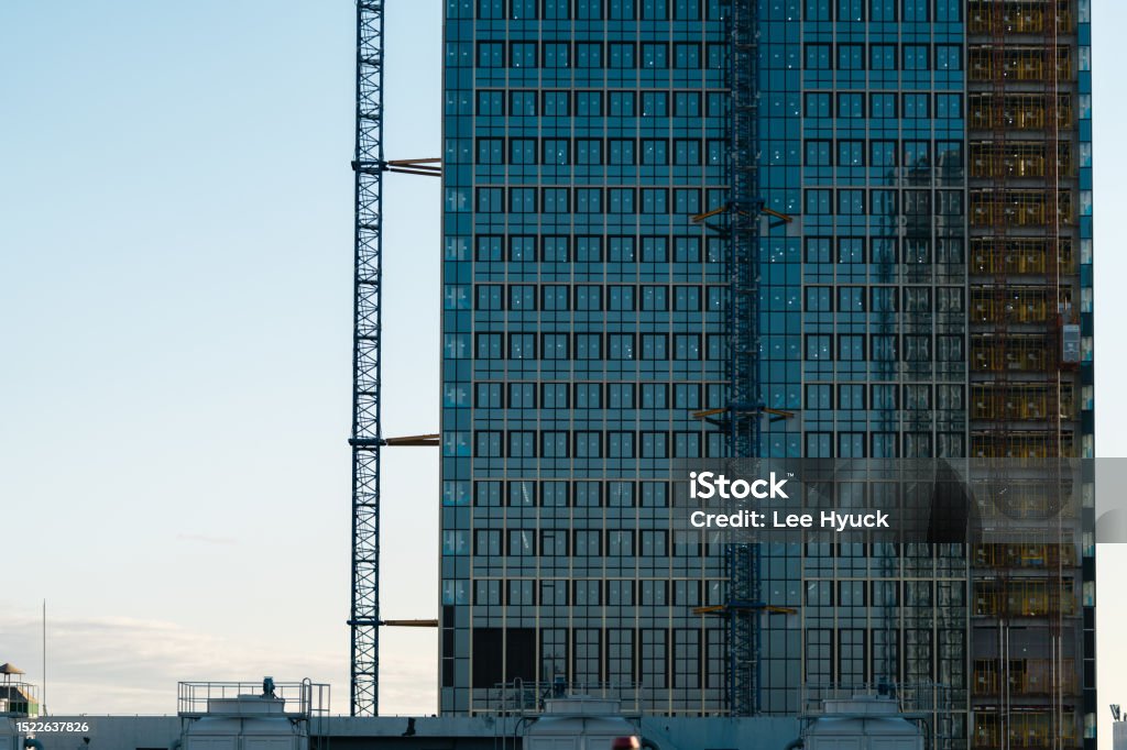 A Building Under Construction With Most Of Its Exterior Filled With ... A Building Under Construction With Most Of Its Exterior Filled With ...