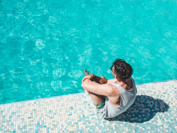 Free Stock Photo of Man in swimwear sitting by swimming pool | Download ...