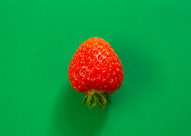 Free Stock Photo of Close Up of a Strawberry on Green Background ...