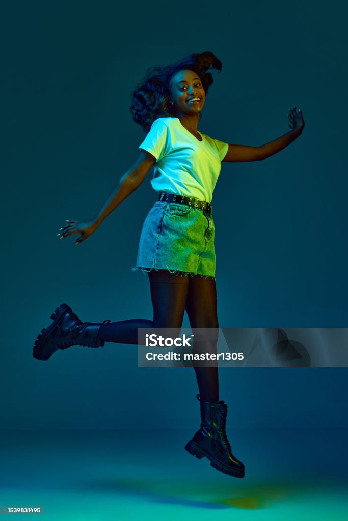 Fulllength Portrait Of Cheerful Happy Young African Woman In Casual
