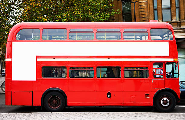 Free Stock Photo of Red and White Bus Driving Next to Red Car on Street ...