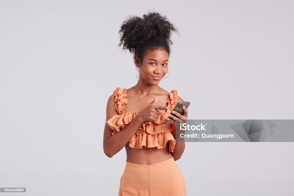 Techsavvy Style Black Girl In Orange Shirt Poses And Clicks With