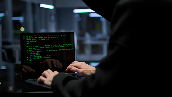Computer Hacker Typing Code On Keyboard Late Night Working And Bypassing Cyber Security Stock