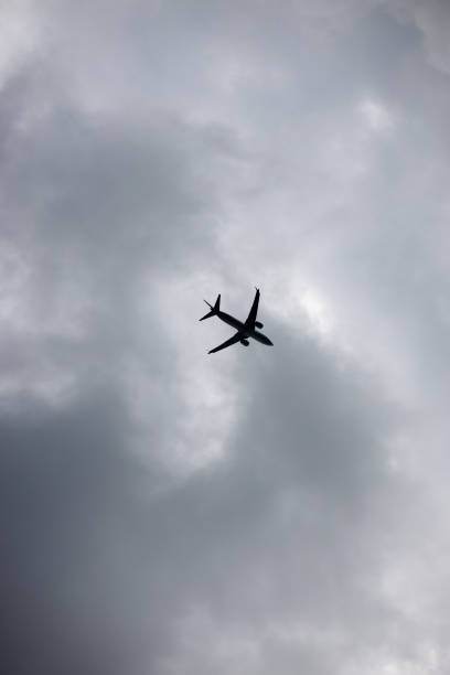 Free Stock Photo of Plane Flying Through Dark Cloudy Sky | Download ...