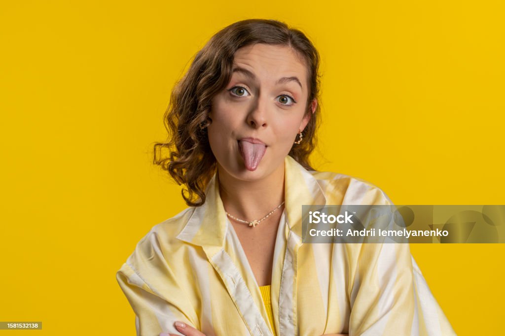 Cheerful Funny Bully Young Woman Showing Tongue Making Silly Faces