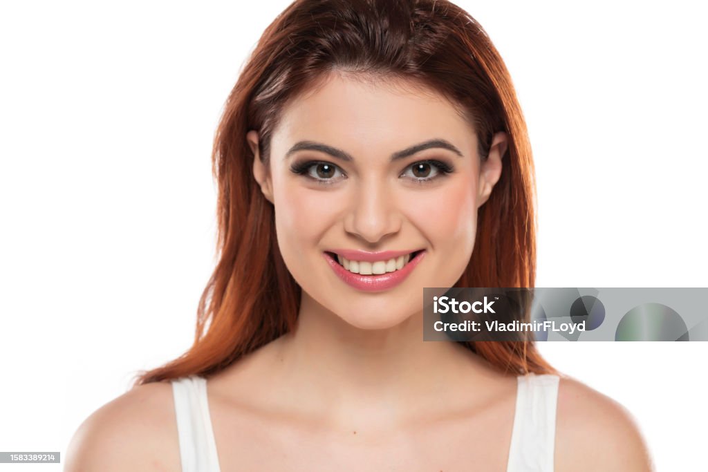 Beautiful Young Smiling Redhead Women With Makeup And Long Hair On A