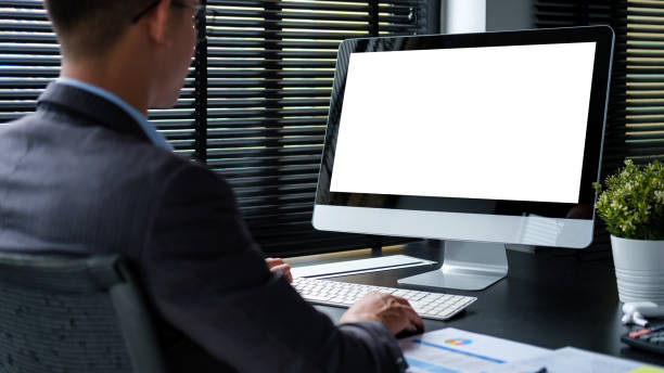 Free Stock Photo of Man working at a desk with a computer in a room ...