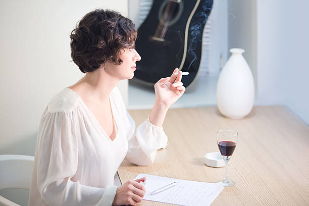 Free Stock Photo of Woman Smoking Cigarette at Desk | Download Free ...