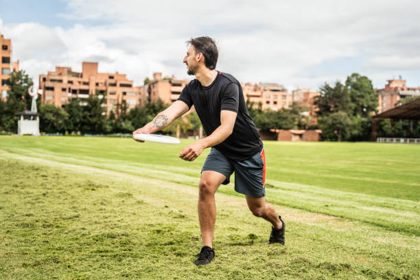 Free Stock Photo of Man Playing Frisbee in a Field | Download Free ...