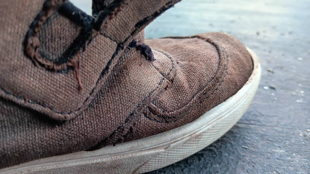 Free picture: Foot in old fashioned sneakers on cast iron chain black ...