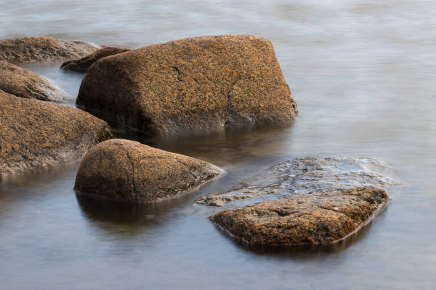 Free Stock Photo of Two Large Rocks Resting on Water Surface | Download ...