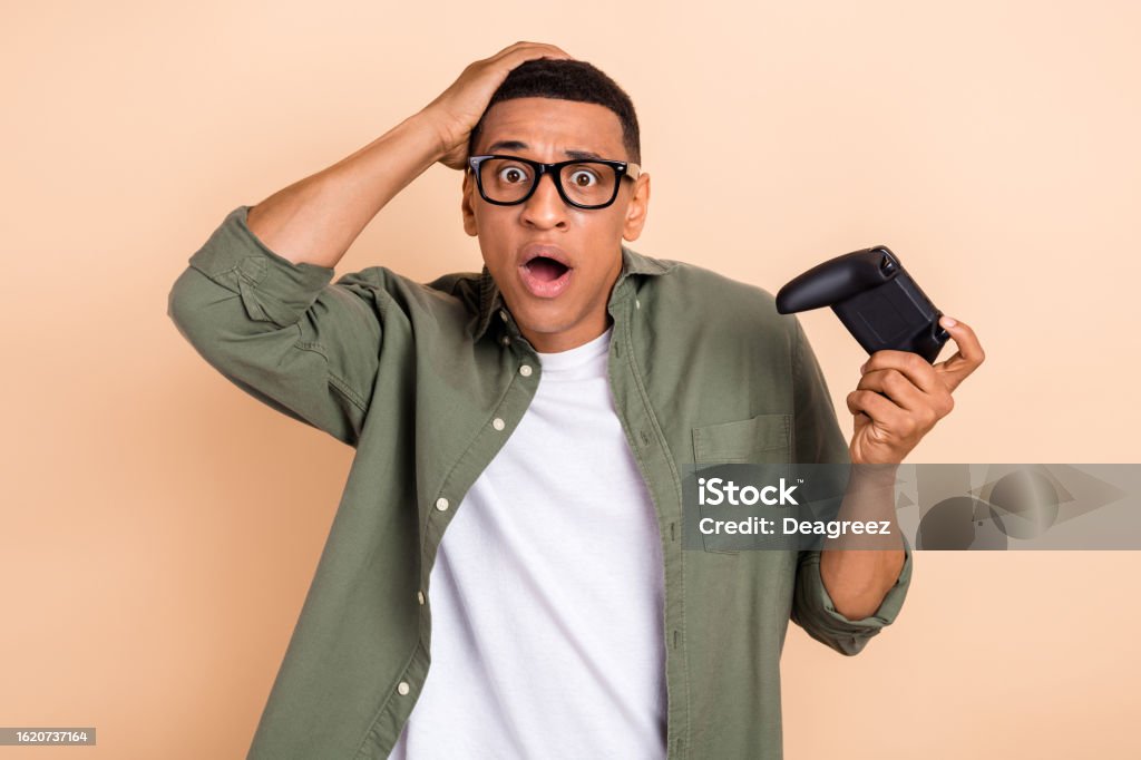 Photo Of Funny Shocked Man Wear Khaki Shirt Eyeglasses Loosing