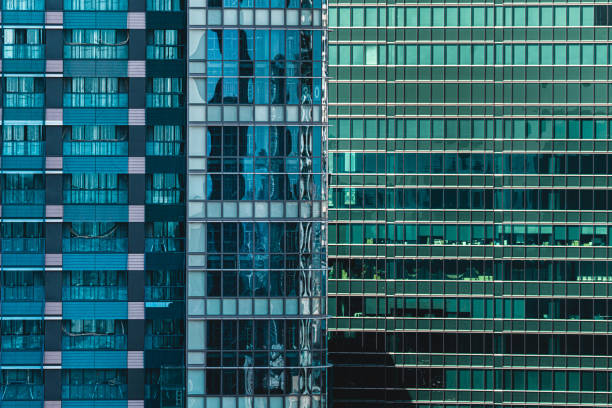 Free Stock Photo of Modern glass skyscraper reflecting adjacent ...