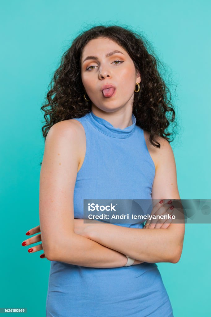 Cheerful Funny Bully Young Woman Showing Tongue Making Silly Faces