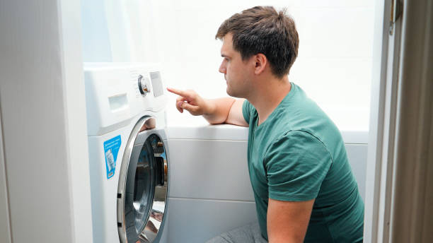 Free Stock Photo of adult man loading the washing machine | Download ...