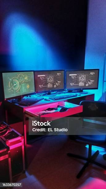 Shot Of Multiple Personal Computer Monitors Showing Coding Language Program With System