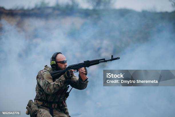 Portrait Of Ukrainian Soldier Shooting From His Rifle While Practicing ... Portrait Of Ukrainian Soldier Shooting From His Rifle While Practicing ...