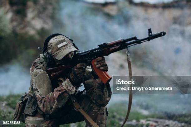Portrait Of Ukrainian Soldier Shooting From His Rifle At The Range ... Portrait Of Ukrainian Soldier Shooting From His Rifle At The Range ...