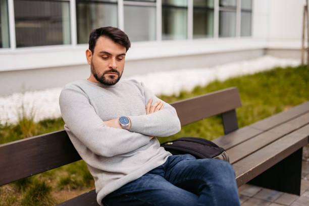 Free Stock Photo of Man Sitting on Bench in Front of Building ...