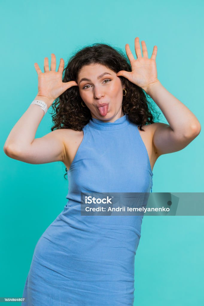 Funny Comical Woman Making Silly Facial Expressions And Grimacing