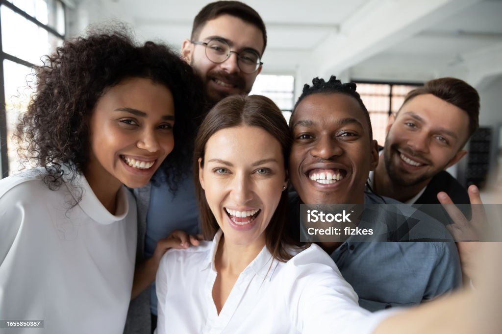 Smiling Multiethnic Colleagues Make Selfie In Office Together Stock