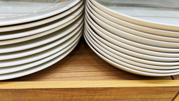 Free Stock Photo of Stack of assorted dinner plates on shelf | Download ...