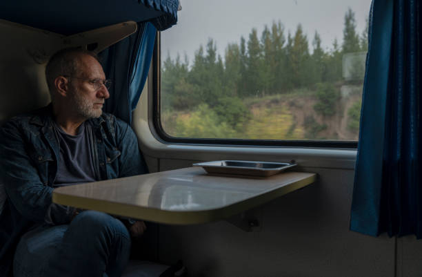 Free Stock Photo of Man Sitting on Train, Looking Out Window | Download ...