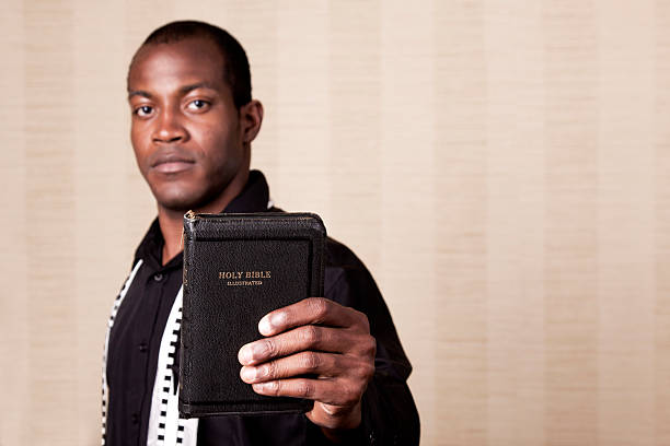 Man Holding Bible Pictures | Download Free Images on Unsplash