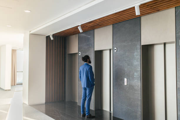 Free Stock Photo of Man waiting for an elevator in a hallway | Download ...